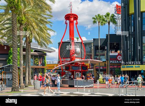 People Tourists Walking Along CityWalk At Universal Studios Resort Orlando Florida USA Stock