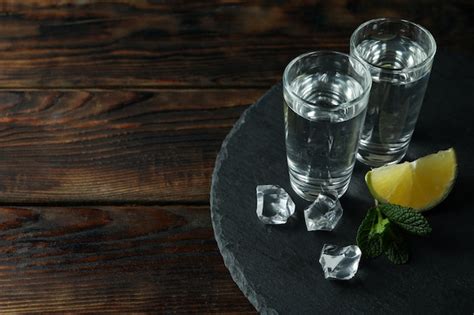 Premium Photo Tray With Shots Of Vodka On Wooden