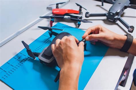 Premium Photo Closeup Shot Of Man Working On Assembling New Surveillance System Using