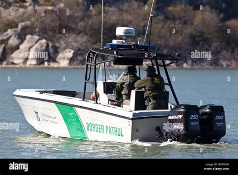 U S Border Patrol Agents On The Rio Grande River Arm Of Lake Amistad