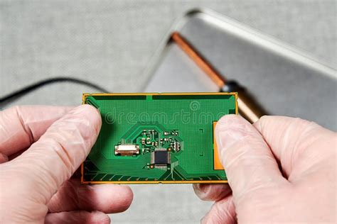 An Engineer Working On Microchip Development In Tech Laboratory Stock