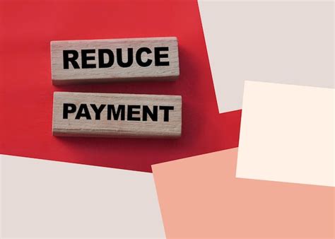 Premium Photo Wooden Blocks With The Words Reduce Payment Business