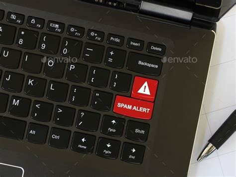 Laptop On Workspace Area With Cyber Security Red Keyboard Key With Spam