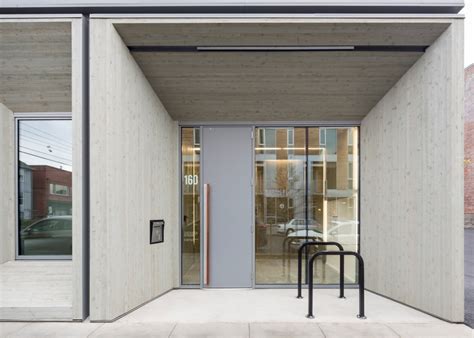 Glass Facade Reveals Timber Structure Of Portland Office Building
