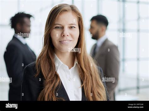 Beautiful Business Woman Looking Straight Ahead With A Smile Stock