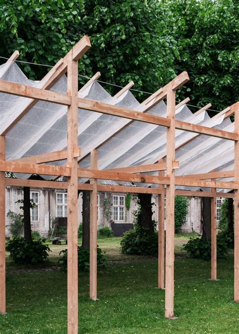 Timber Structure In A Lush Green Field