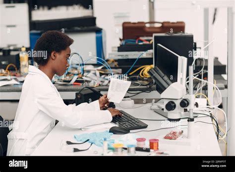 Scientist African American Woman Working In Laboratory With Computer