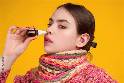 The Nasal Spray Female In Scarf Using Nasal Spray Medicine For Runny