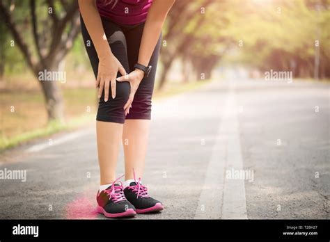 Runner Sport Knee Injury Woman In Knee Pain While Running Work Out In