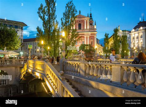 Franciscan Church Of The Annunciation And Triple Bridges At Dusk