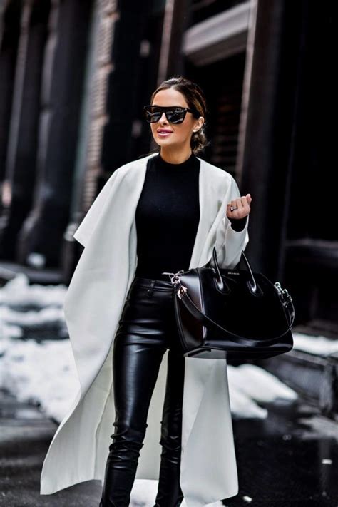 Fashion Blogger Mia Mia Mine Wearing A White Trench Coat And Black Bodysuit At New York Fashion