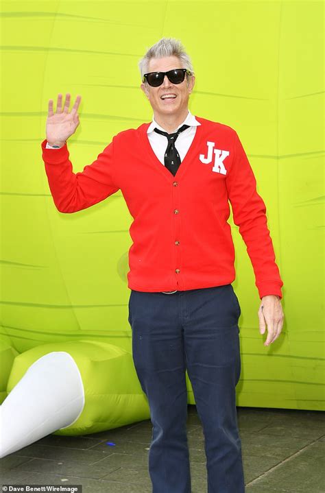 Johnny Knoxville Poses In Front Of A Questionable Inflatable Dinosaur For Jackass Forever