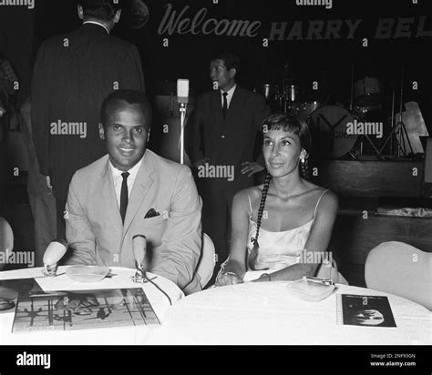 An Affable Harry Belafonte And His Wife Julie Smile During A Press