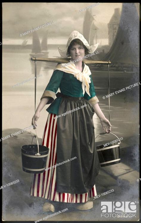 Woman In Traditional Dutch Costume 1 Of 2 Stock Photo Picture And