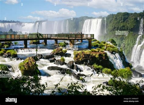 Viewing Platform Surrounded By Water Cascading Over Multiple Falls With