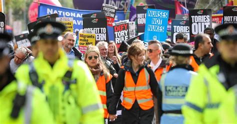 Thousands Of Protesters March Through Manchester City Centre As