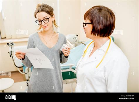 Young Woman Patient With A Senior Gynecologist During The Consultation