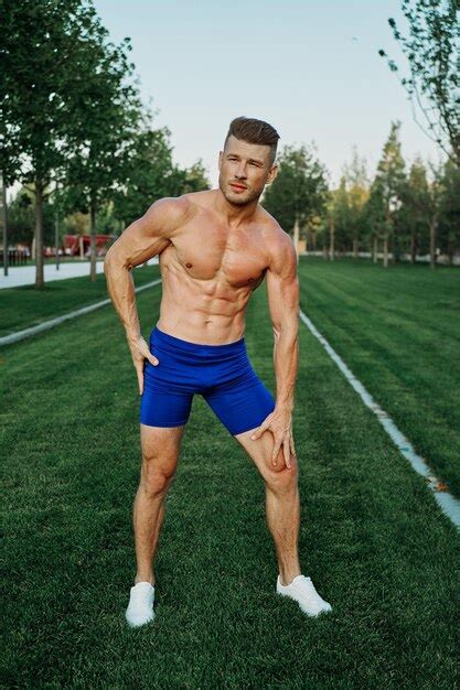 Premium Photo Portrait Of Shirtless Man Standing On Field