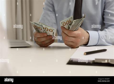 Cashier Counting Money At Desk In Bank Closeup Stock Photo Alamy