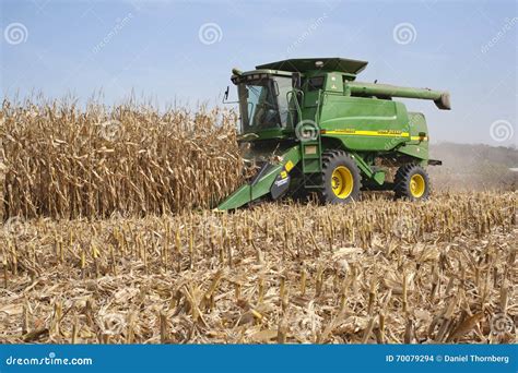 Farmer In A John Deere Combine Harvesting Corn Editorial Stock Image