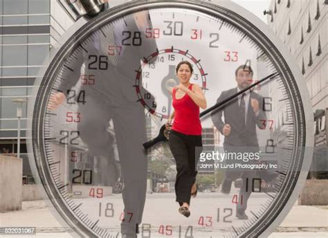 Double Exposure Of Stopwatch And Business People Running Outdoors Photo