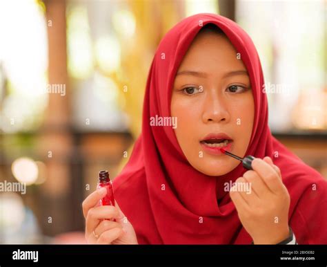 Mirror Reflection Of Young Happy And Beautiful Muslim Woman In