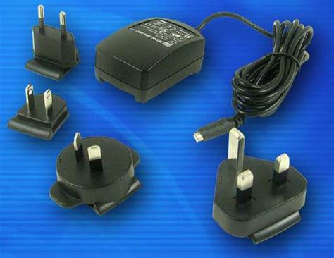 External power adapter combines USB power with interchangeable ac plugs ...