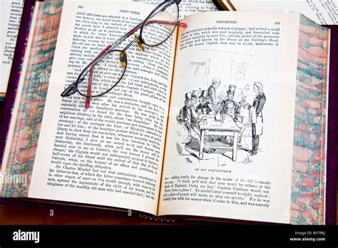 Old Fashioned Book Open On Page With Illustration And Reading Glasses