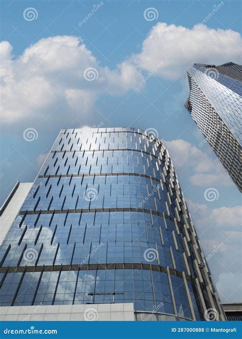 Glass Paneled Office Building The Glass Is Blue Sky Background View