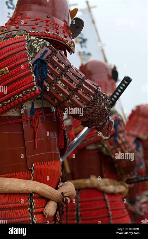 Samurai Warriors In Full Armor Costume With Kabuto Helmets Draw Their