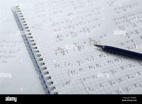 Notebook With Different Mathematical Formulas And Pen Closeup Stock