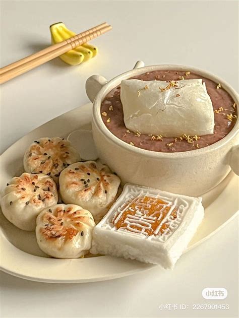 Delicious Asian Food On A Plate With Chopsticks And A Bowl Of Soup