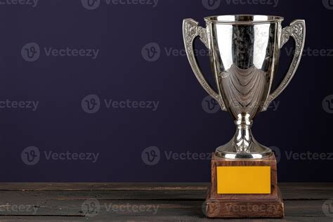 Silver Trophy With Blank Yellow Nameplate On Wooden Base 55024113 Stock