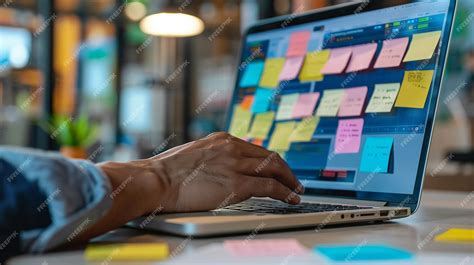 Business Developer Using Kanban Board Framework On Laptop Screen Premium Ai Generated Image