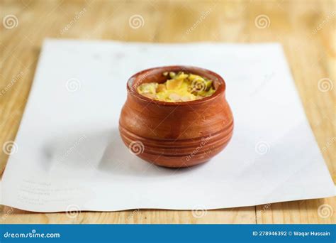 Firni Phirni Anf Kheer With Nuts Served In Pot Isolated On Mat Top
