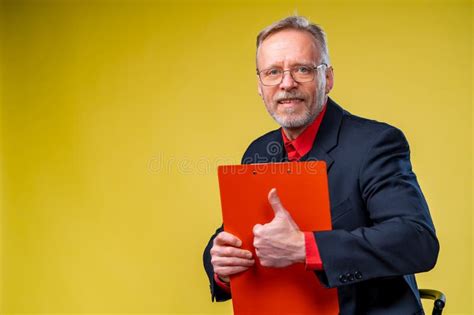 Middle Aged Businessman Standing And Holding File Folder Horizontal