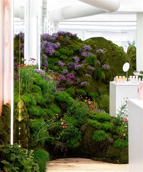 Glossier Pop Up Shop In Seattle Features Rolling Hills Covered In Moss