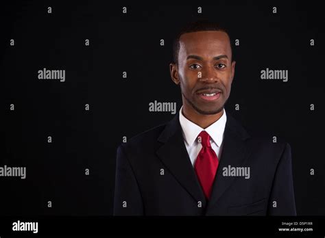 Black Man In Dark Suit White Shirt And Red Tie A Successful