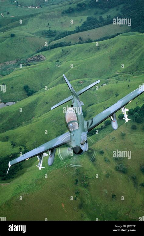 Brazilian Air Force Embraer Emb 314 Super Tucano Banking Over Fields