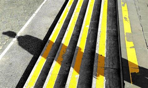 Premium Photo High Angle View Of Yellow Crossing Markings On Road