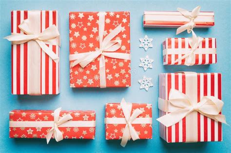 A Lot Of Christmas T Boxes In Colored Paper Decorated On Table Top