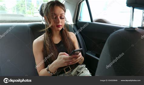 Beautiful Passenger Girl Back Seat Car Texting Using Cellphone Wind