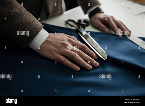 Tailors Hands On The Fabric Custom Tailoring Of Products Tools For