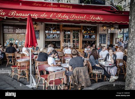 Customers At Traditional Outdoor Parisian Cafe In Center City Stock