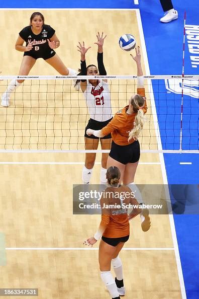 Bella Bergmark Of The Texas Longhorns Goes Up To Hit The Ball Against