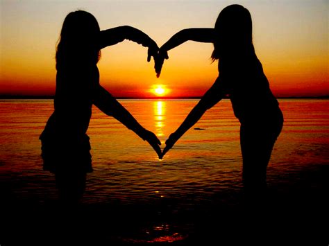 Two Best Friends Holding Hands In The Sunset