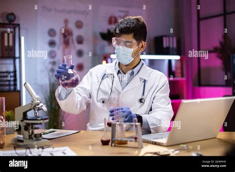 Positive Male Arab Scientist Or Medical In Lab Coat Holding Test Tube