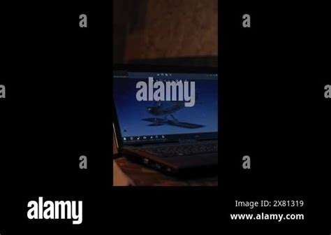Person Uses Program Of 3D Models On Laptop Screen To Make Aircraft Man