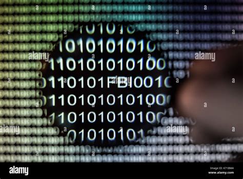 Binary Code Magnifying Glass Shows American FBI Exploit Stock Photo