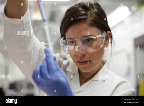 Attractive Female Scientist Testing Using Test Tube Blood And Peppet
